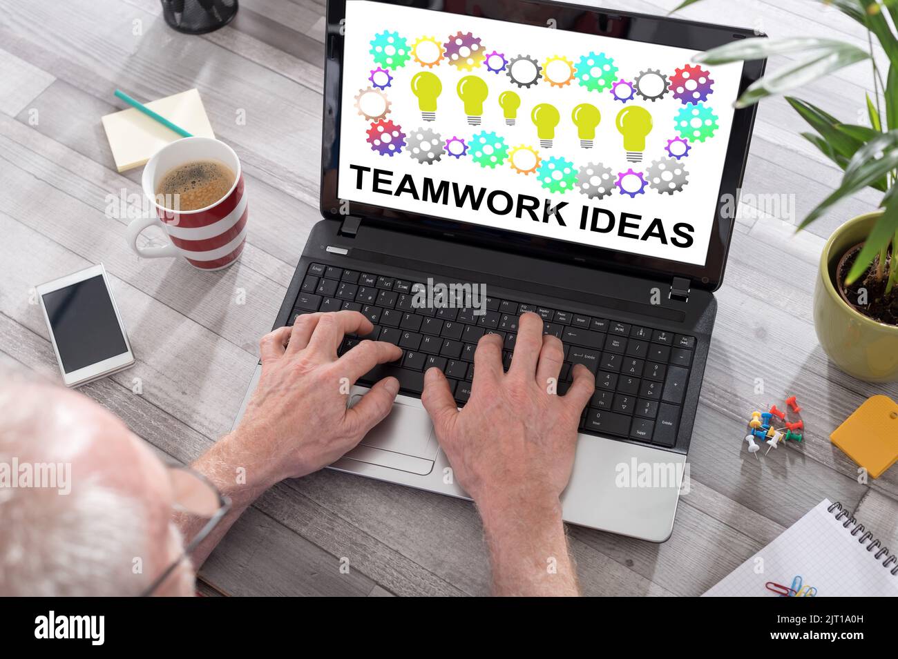 Teamwork idea concept shown on a laptop used by a man Stock Photo - Alamy