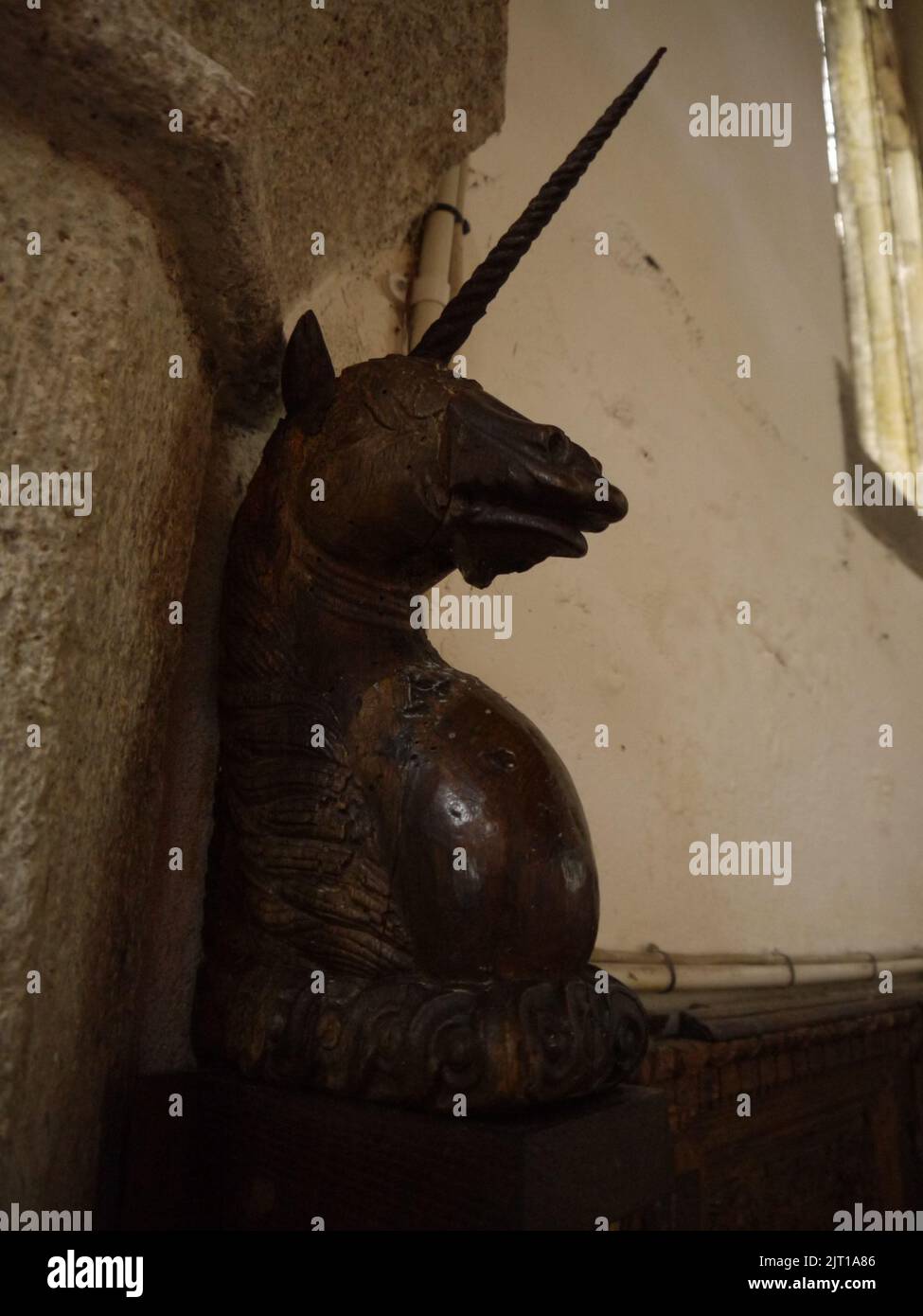 Carved unicorn head pew end at Landulph Church (parish church of St ...