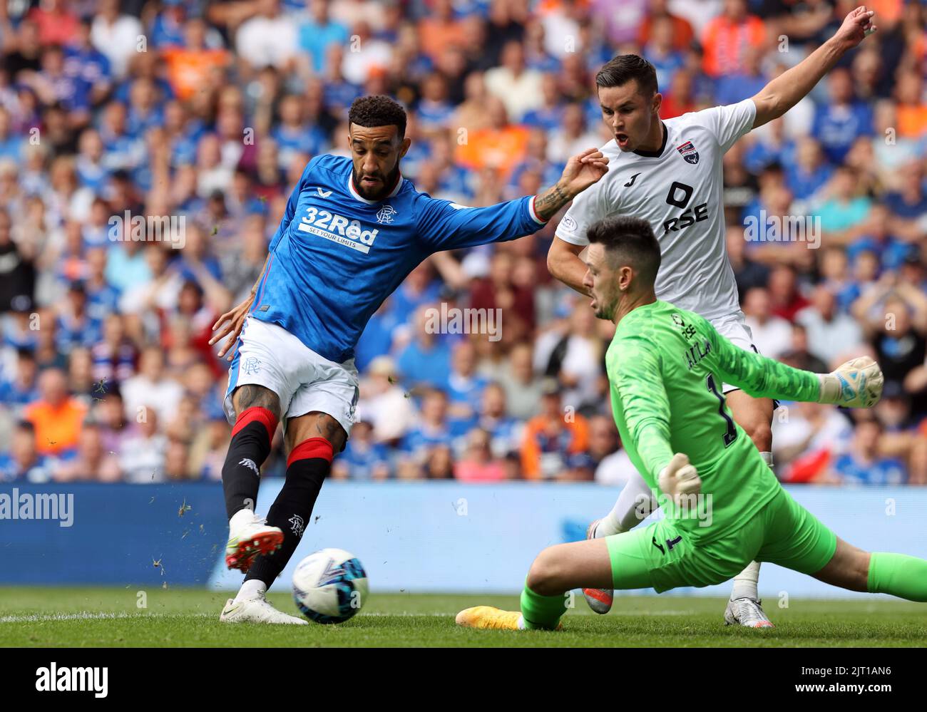 Rangers' Connor Goldson shoots under pressure from Ross County ...