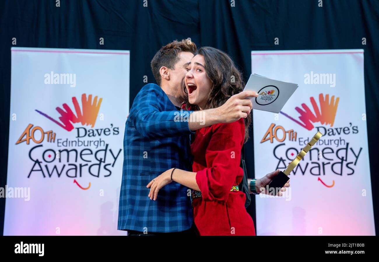Lara Ricote, with Russell Kane (left), reacts after winning the Dave's ...