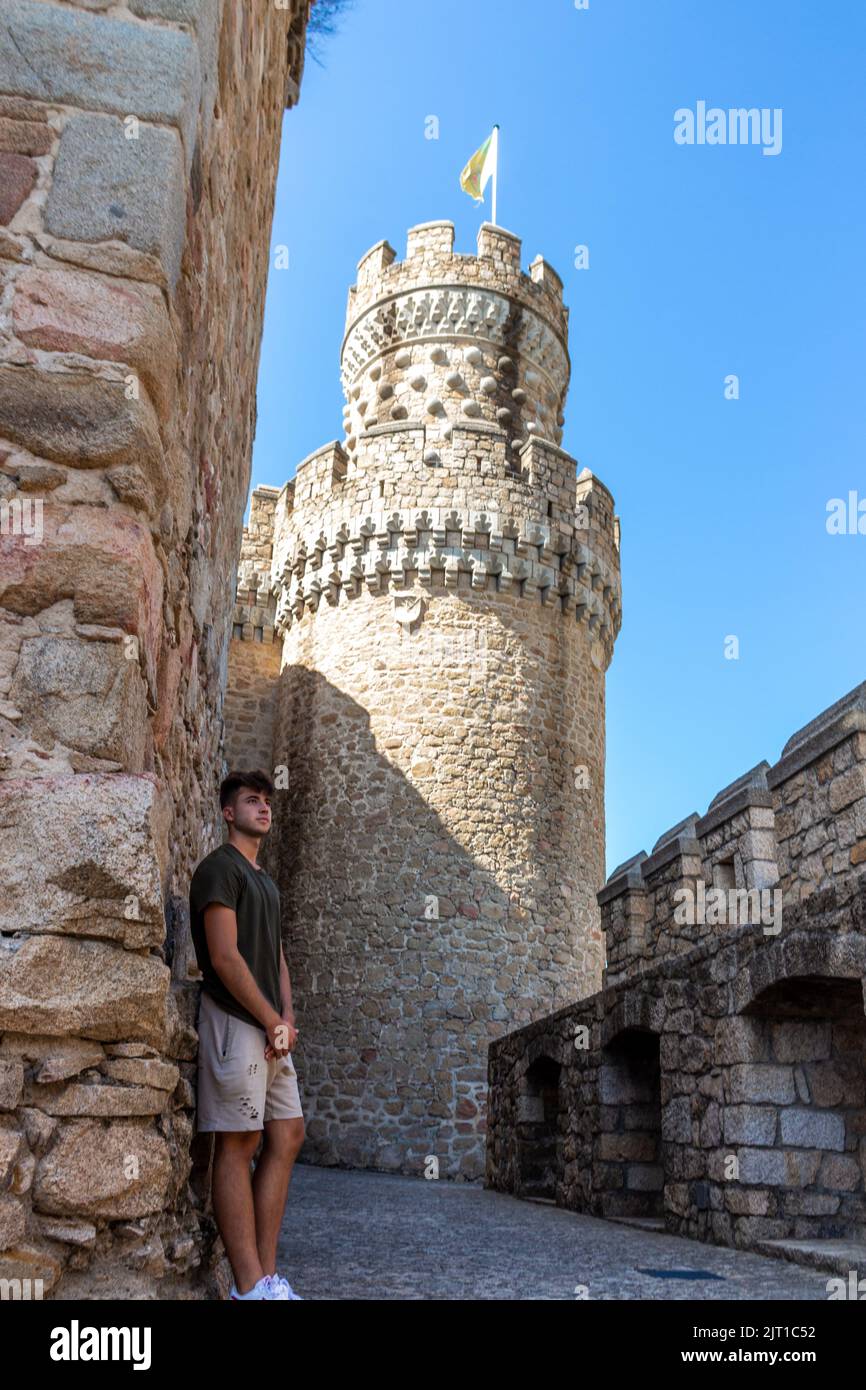 a handsome man visiting an ancient castle Stock Photo - Alamy