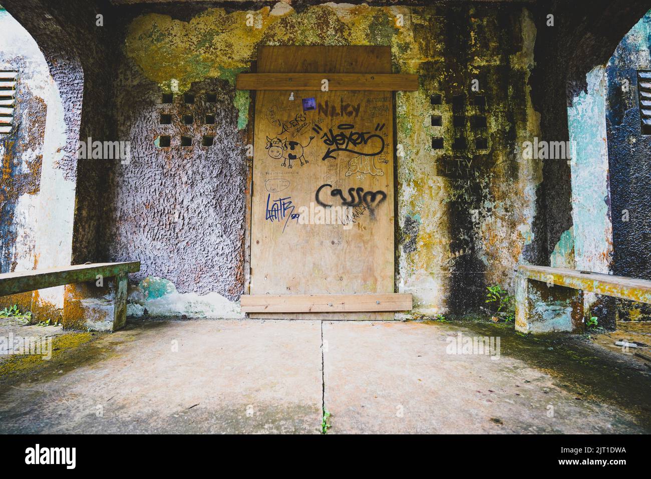 Graffiti on door of abandon bathhouse at Bano Oro wwim area in Puerto ...