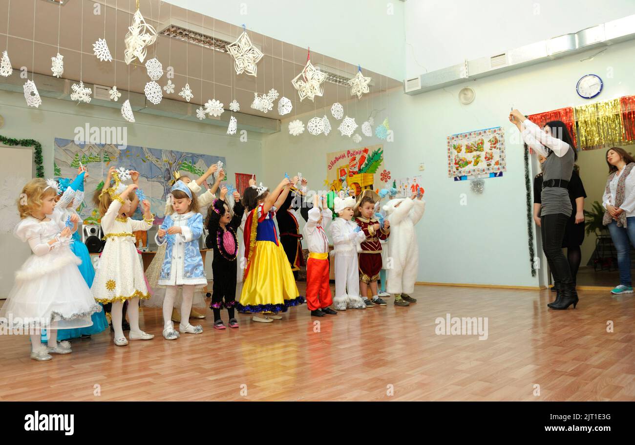 Children in carnival costumes performing in the kindergarten during New ...