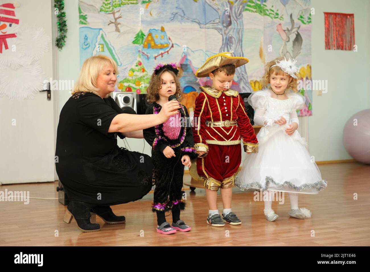 Children in carnival costumes performing in the kindergarten during New ...