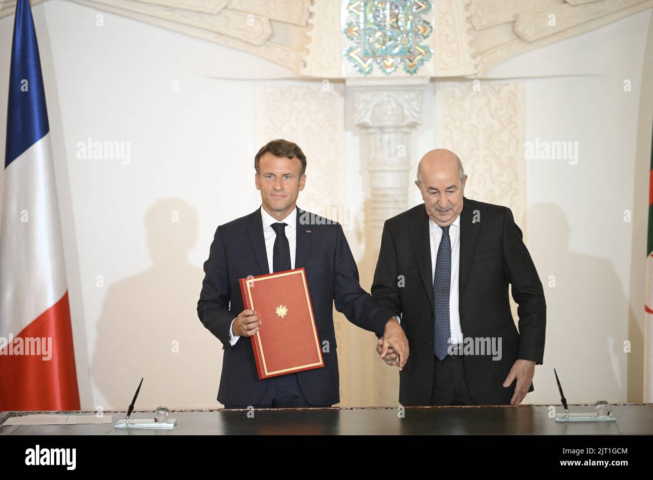 French President Emmanuel Macron and Algeria’s President Abdelmadjid ...