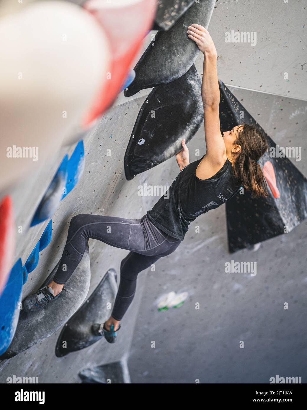 Caucasian young woman bouldering hi-res stock photography and images ...