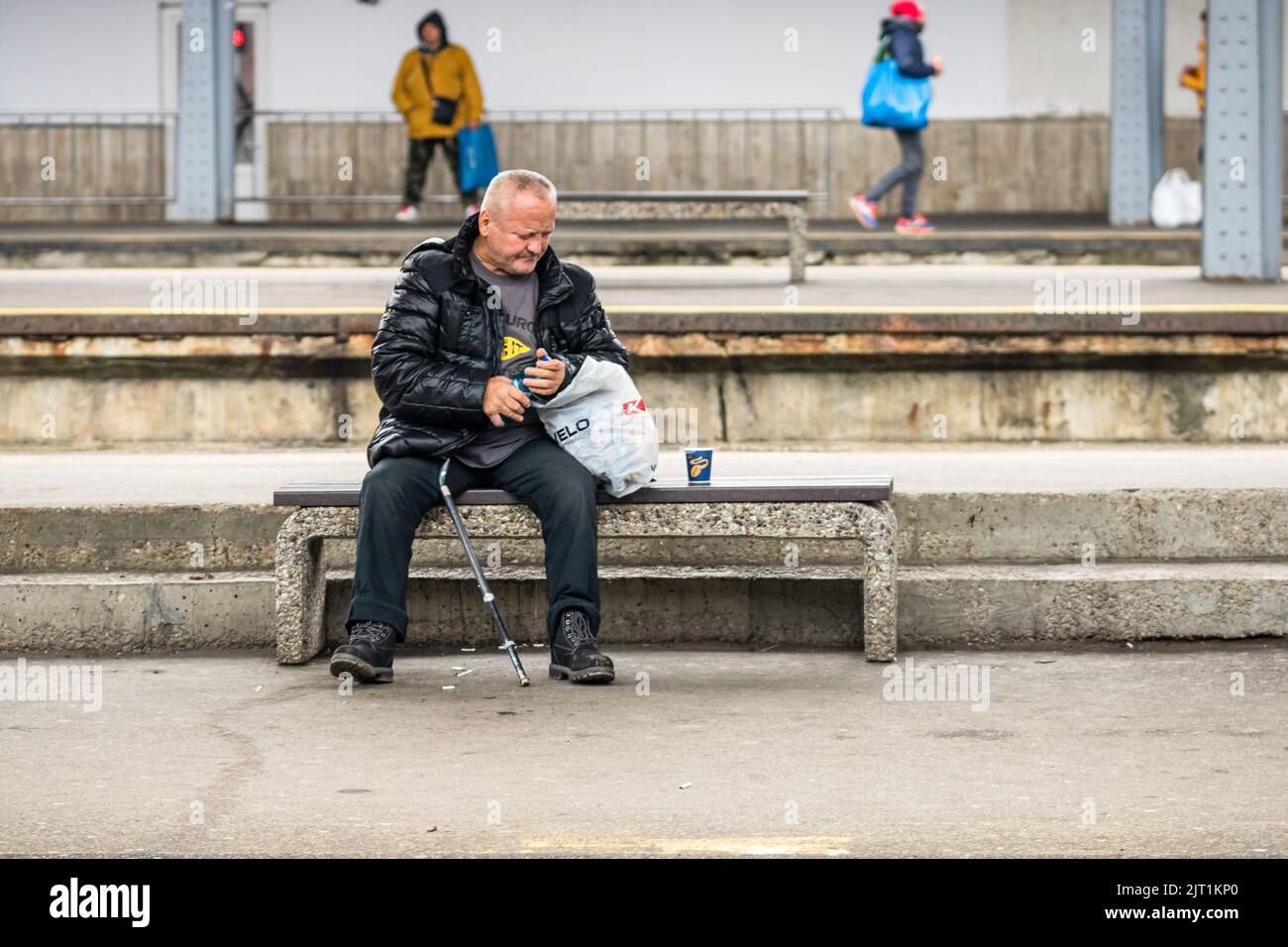 People and tourists wander the streets of the Bucharest Old Town ...