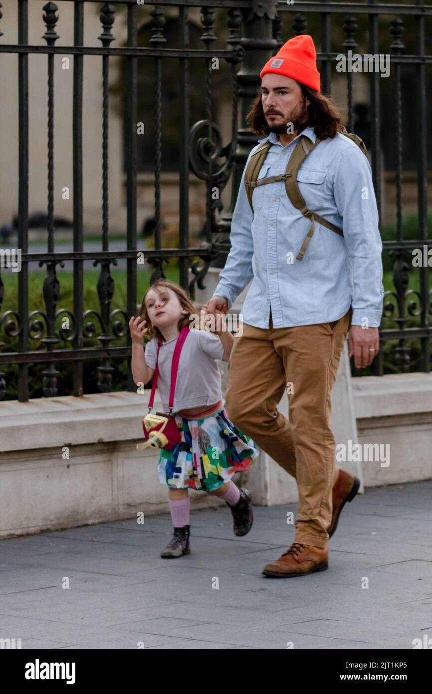 People and tourists wander the streets of the Bucharest Old Town ...