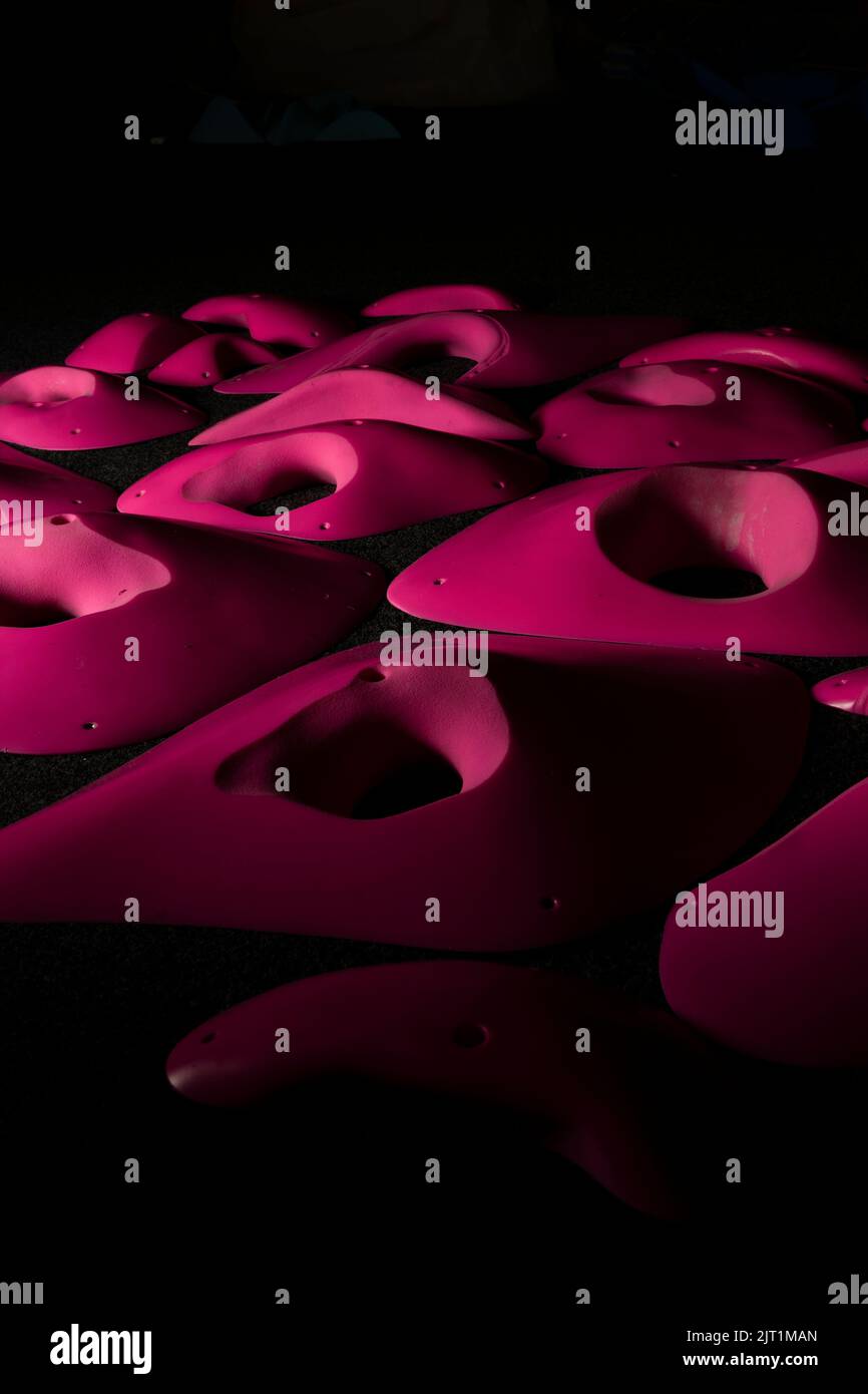 The pink climbing holds in the bouldering gym Stock Photo - Alamy