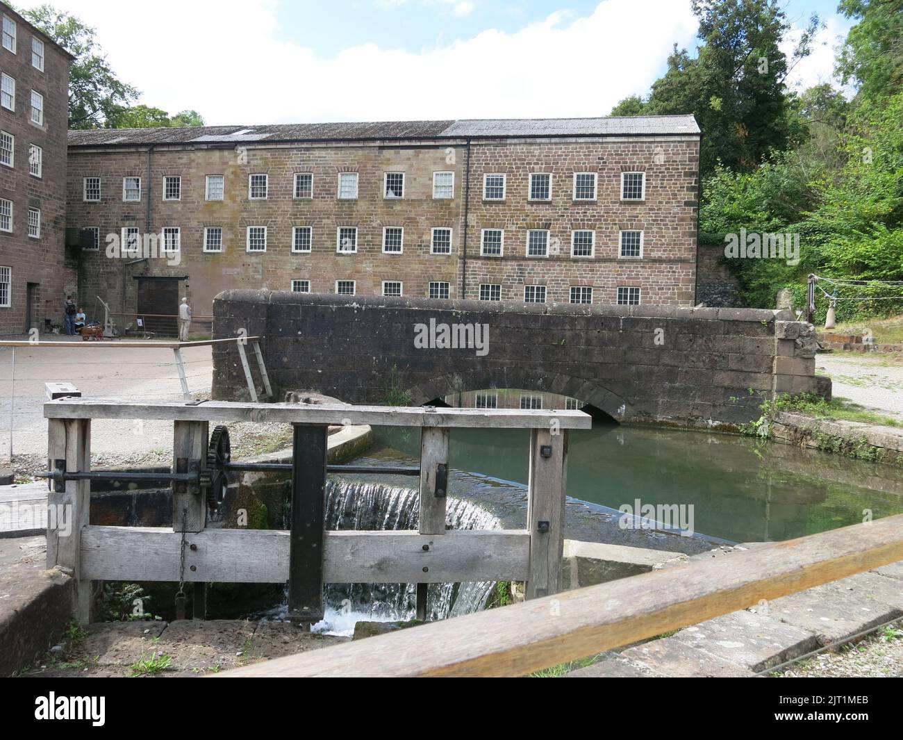 View of the weir and sluice gates in the courtyard at Cromford Mills ...