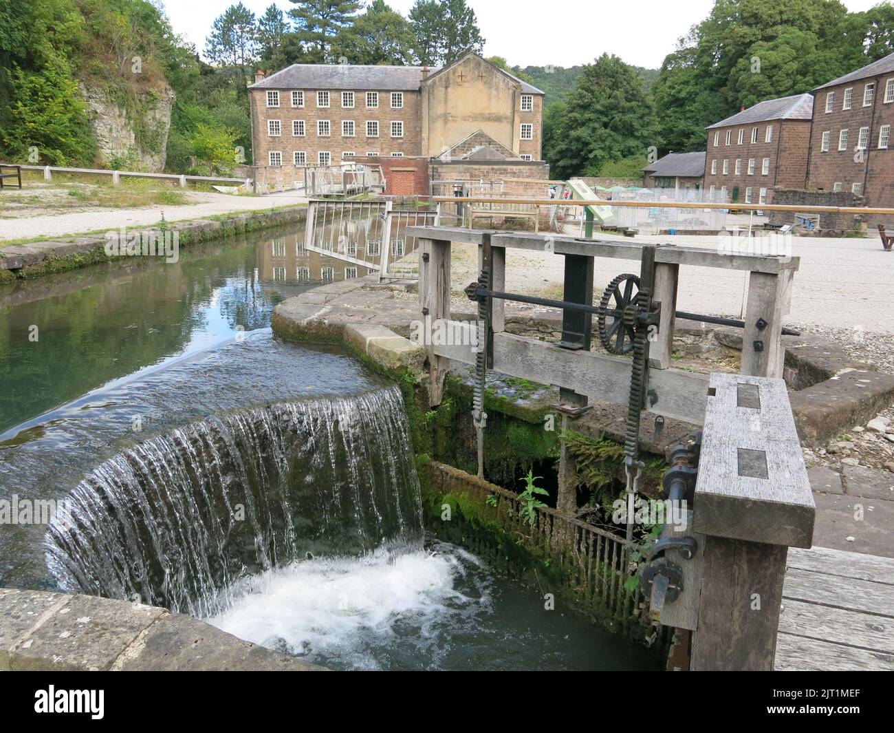 View of the weir and sluice gates in the courtyard at Cromford Mills ...