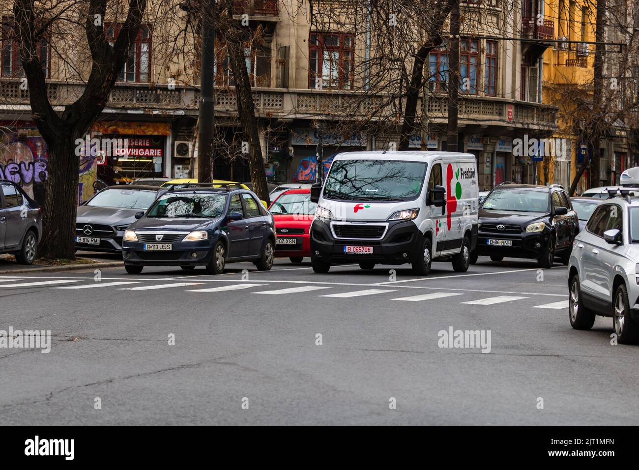 Car traffic at rush hour in downtown area of the city. Car pollution ...