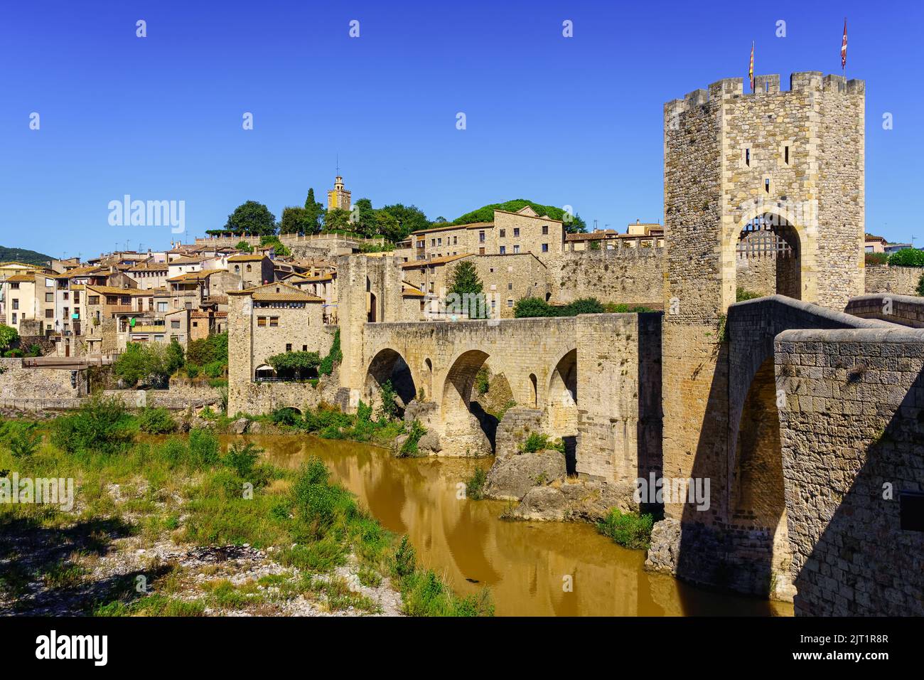 Access by the medieval bridge to the ancient city of Besalu in Girona, Spain Stock Photo - Alamy