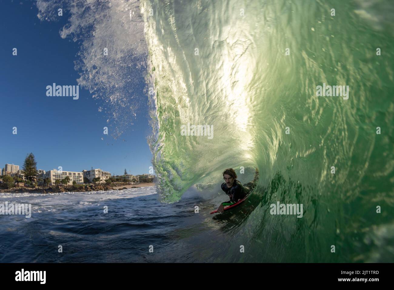 A bodyboarder in the barrel of a wave Stock Photo - Alamy