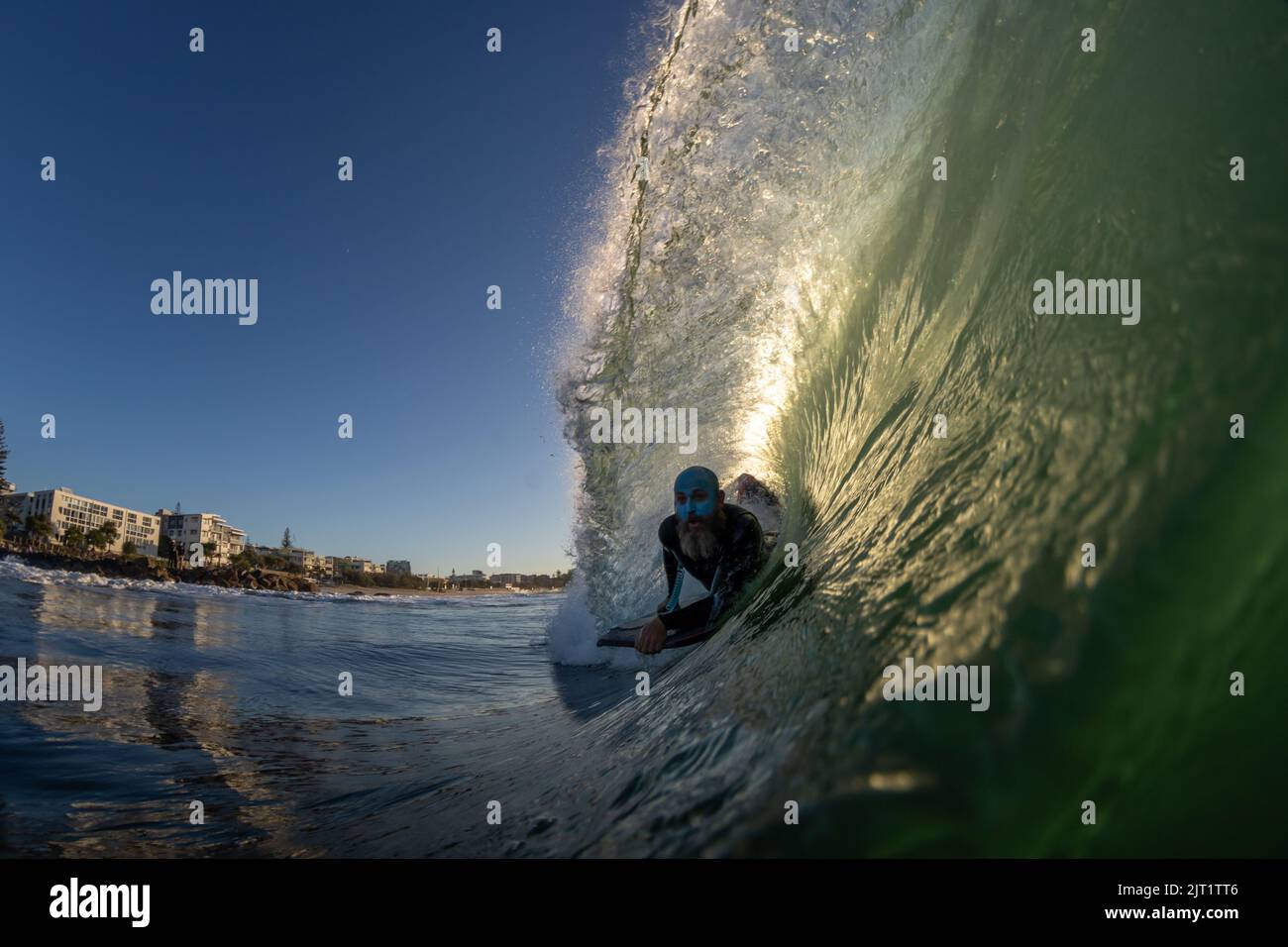 A bodyboarder in the barrel of a wave Stock Photo - Alamy