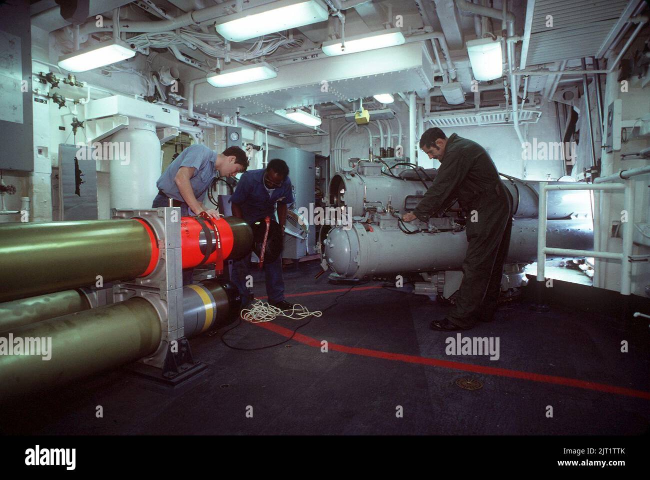 Torpedo handling on USS Leftwich (DD-984) 1986 Stock Photo - Alamy