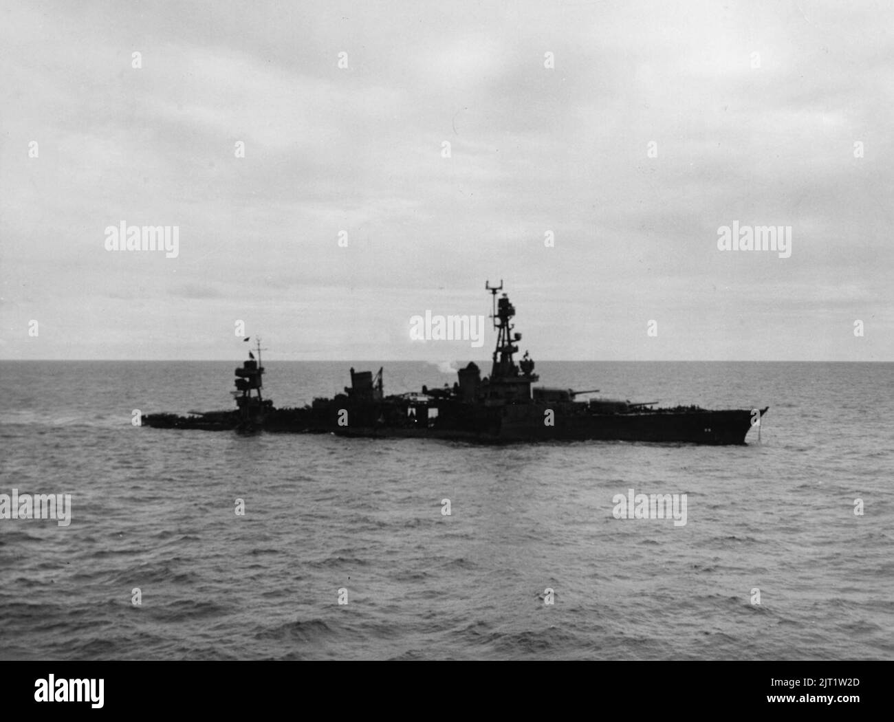 Torpedoed cruiser USS Chicago (CA-29) low in the water on 30 January ...