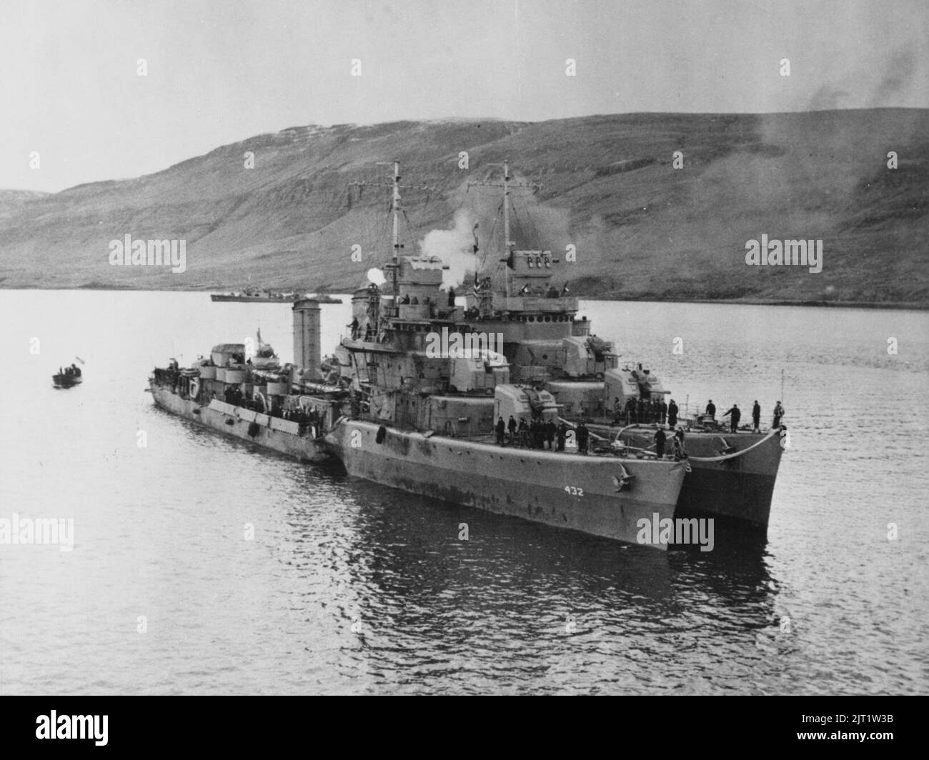 Torpedoed USS Kearny (DD-432) alongside USS Monssen (DD-436) at Iceland ...