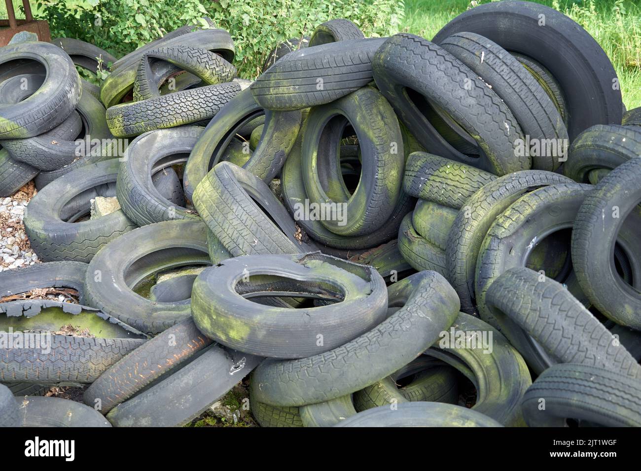 A heap of old discarded rubber tires Stock Photo - Alamy