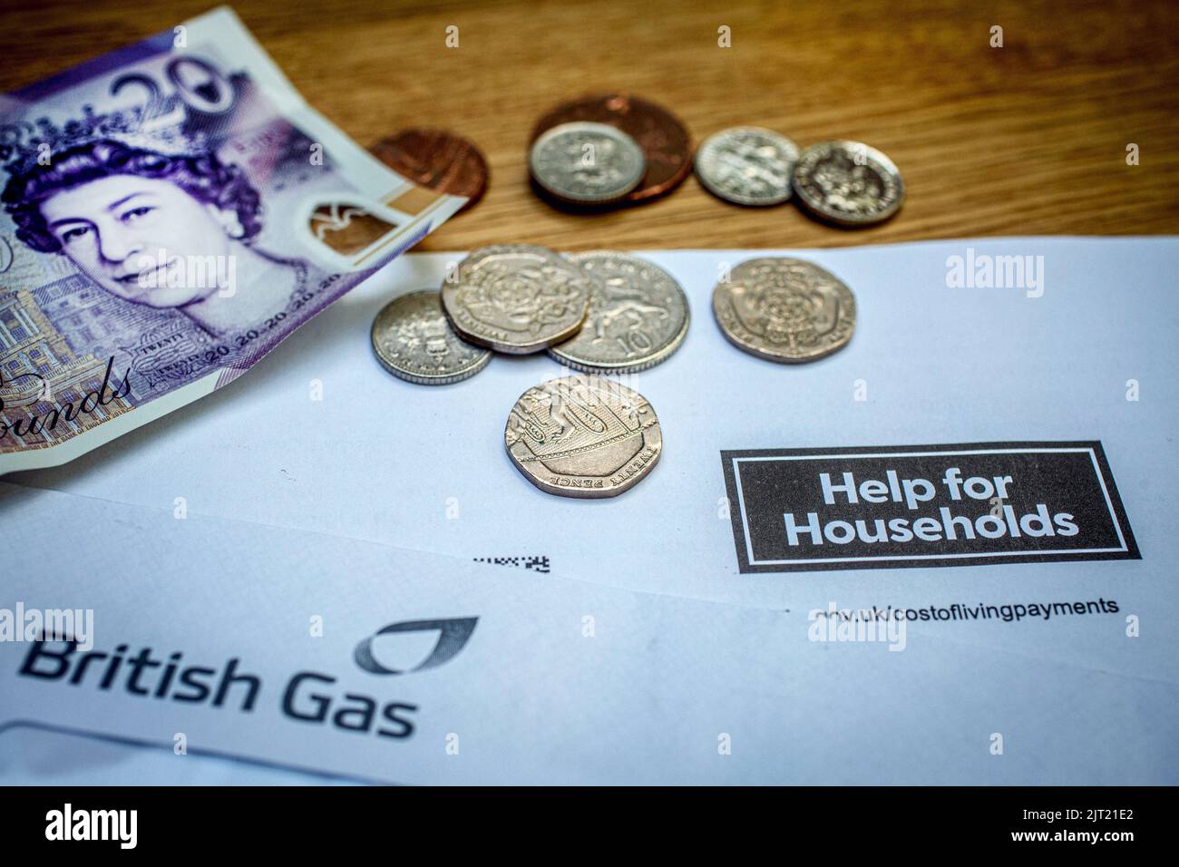 British £20 note and coins on HM Government letter notifying of UK ...