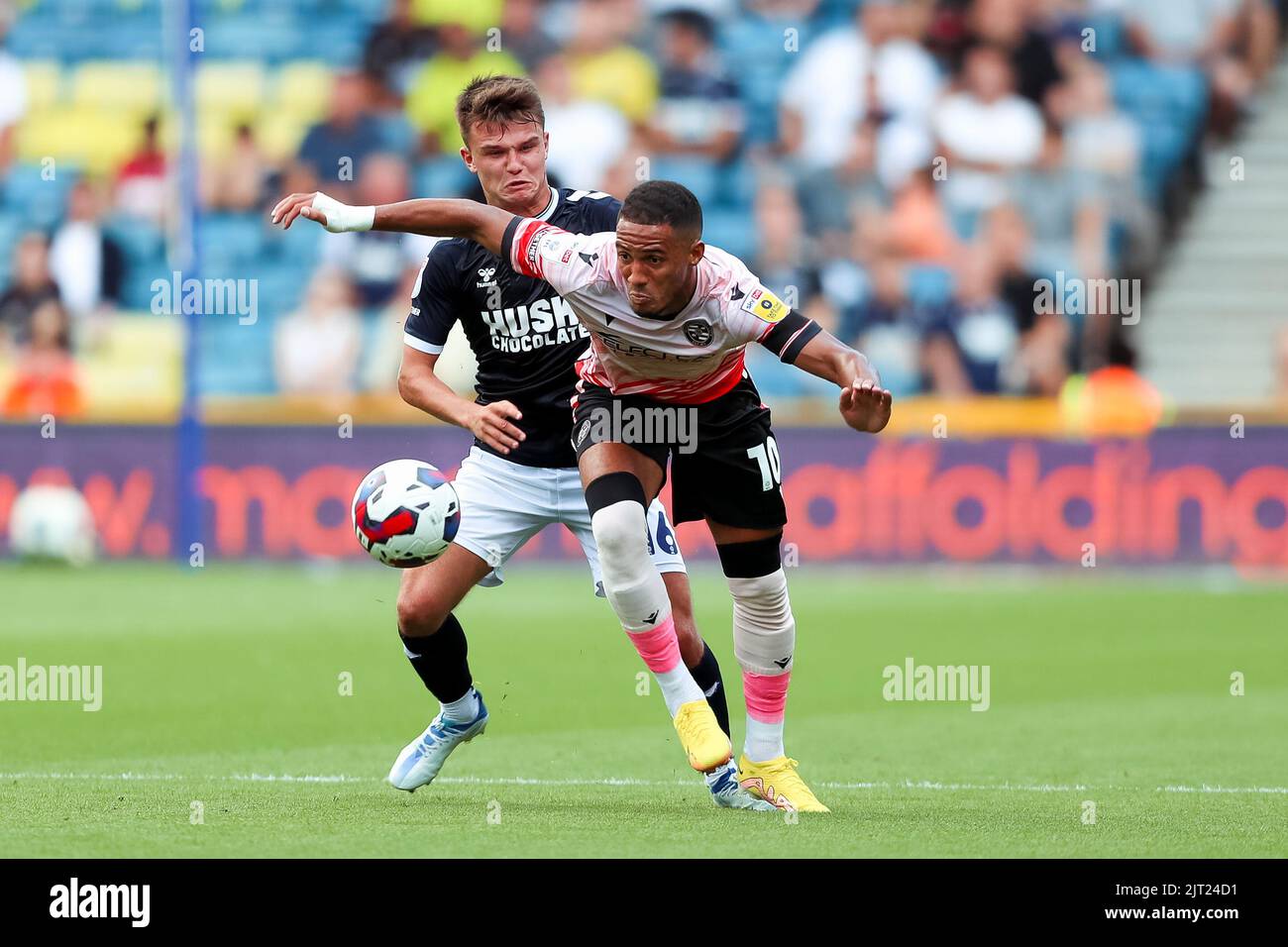 Millwall's Jake Cooper applies pressure to Reading's Tom Ince during ...
