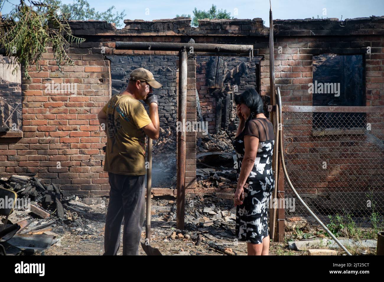 Olia, a resident of Bakhmut stands among the remnants of her home ...