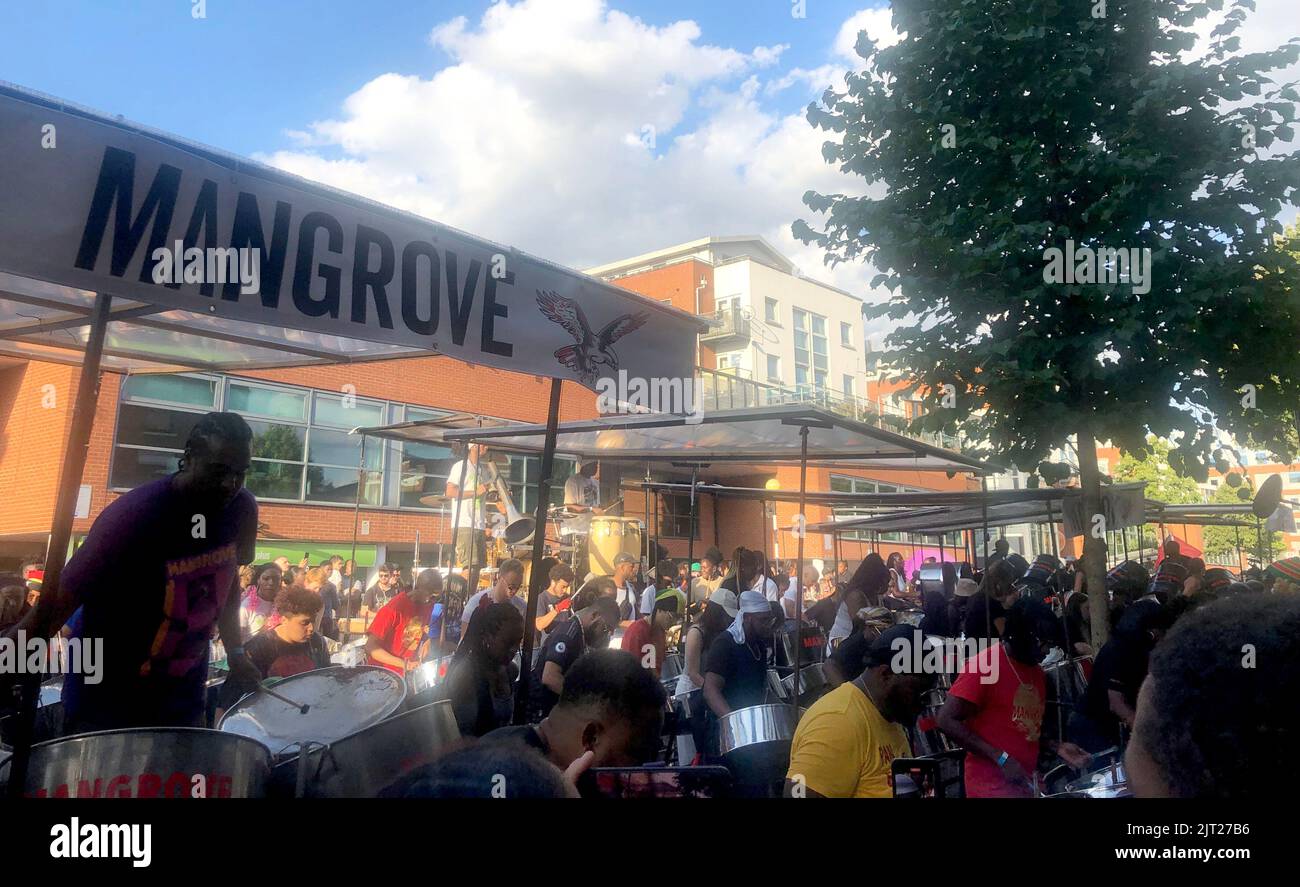 BEST QUALITY AVAILABLE A view of revellers watching steel bands at ...