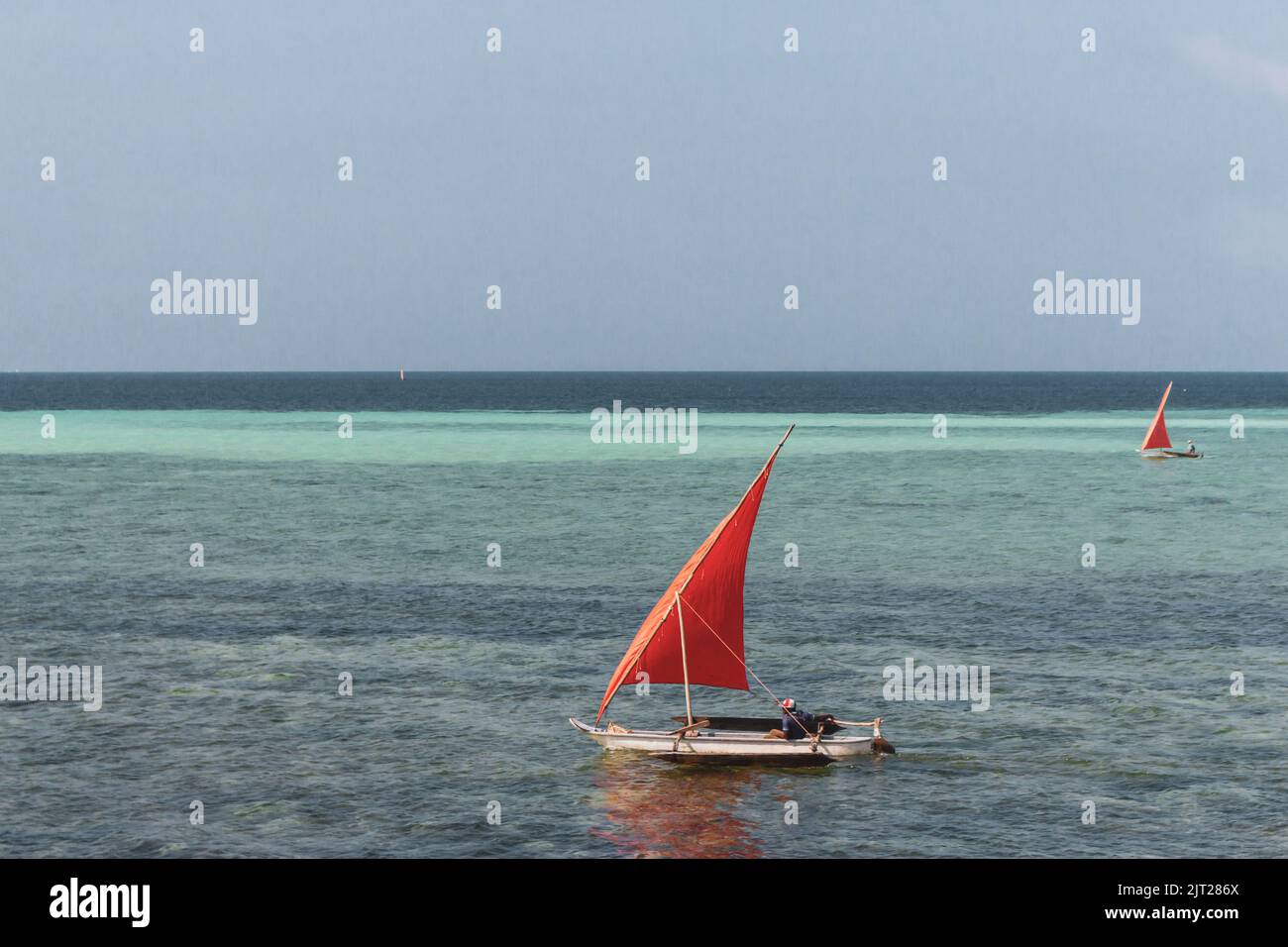 Sailboat with red sail on the sea. Reggata concept. Marine race. Yacht with red sail on tropical ...