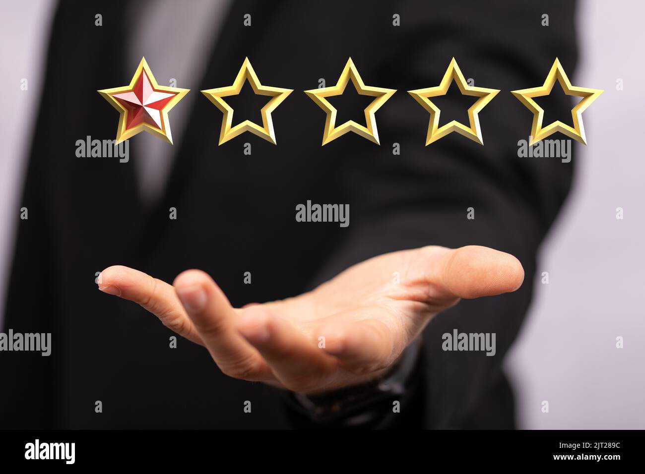 A 3D rendering of floating stars representing concept of review above a ...