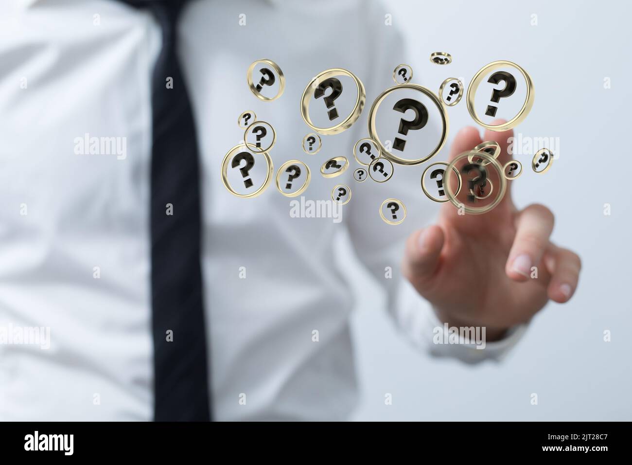A 3d rendering of golden floating question marks in circles with a businessman pointing at them ...