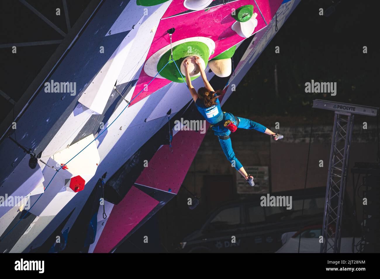 A Japanese athlete jumping on the final route of the IFSC lead world ...