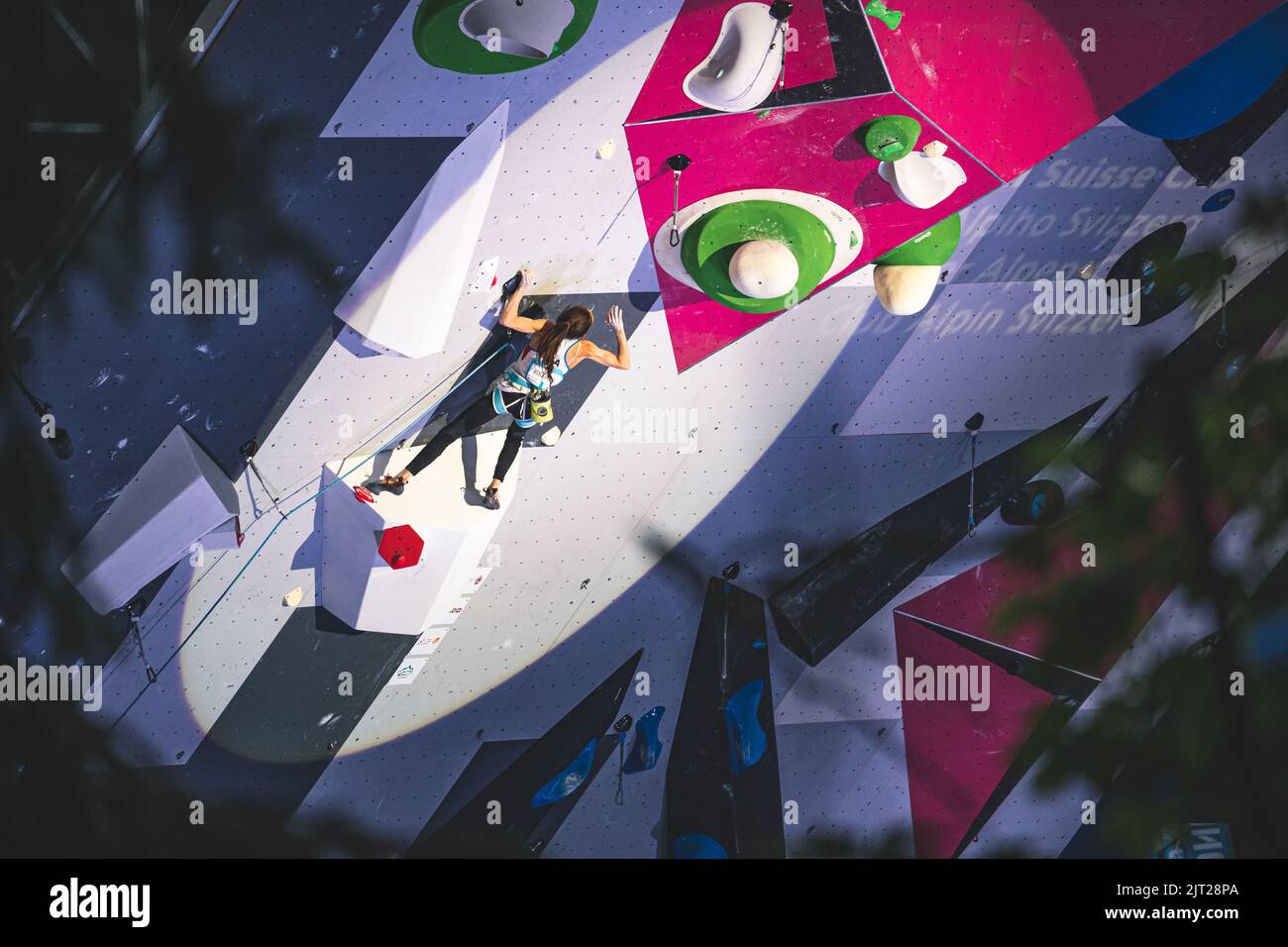 An athlete jumping on the final route of the IFSC lead world cup Stock ...