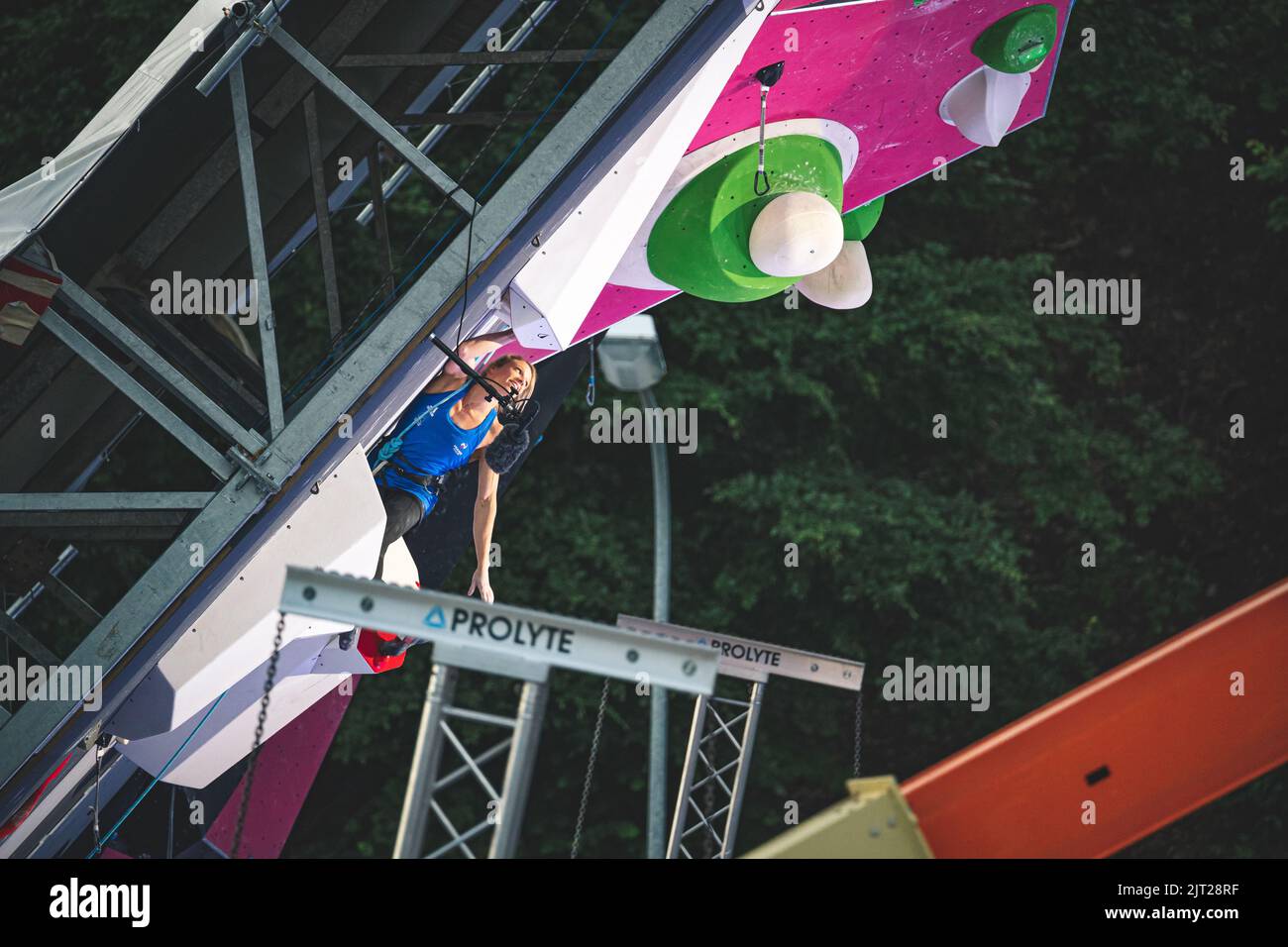 An athlete jumping on the final route of the IFSC lead world cup Stock ...