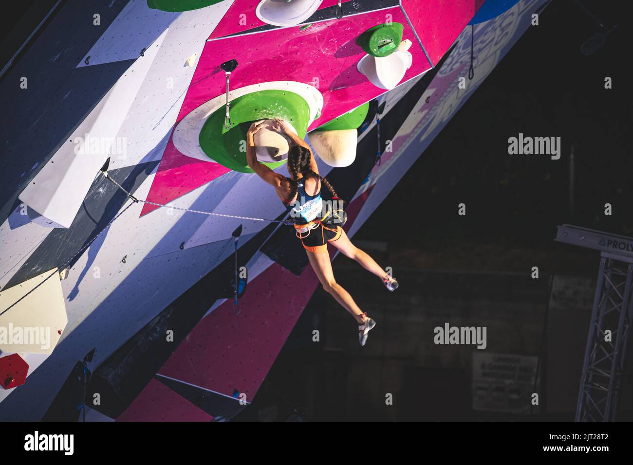 An athlete jumping on the final route of the IFSC lead world cup Stock ...