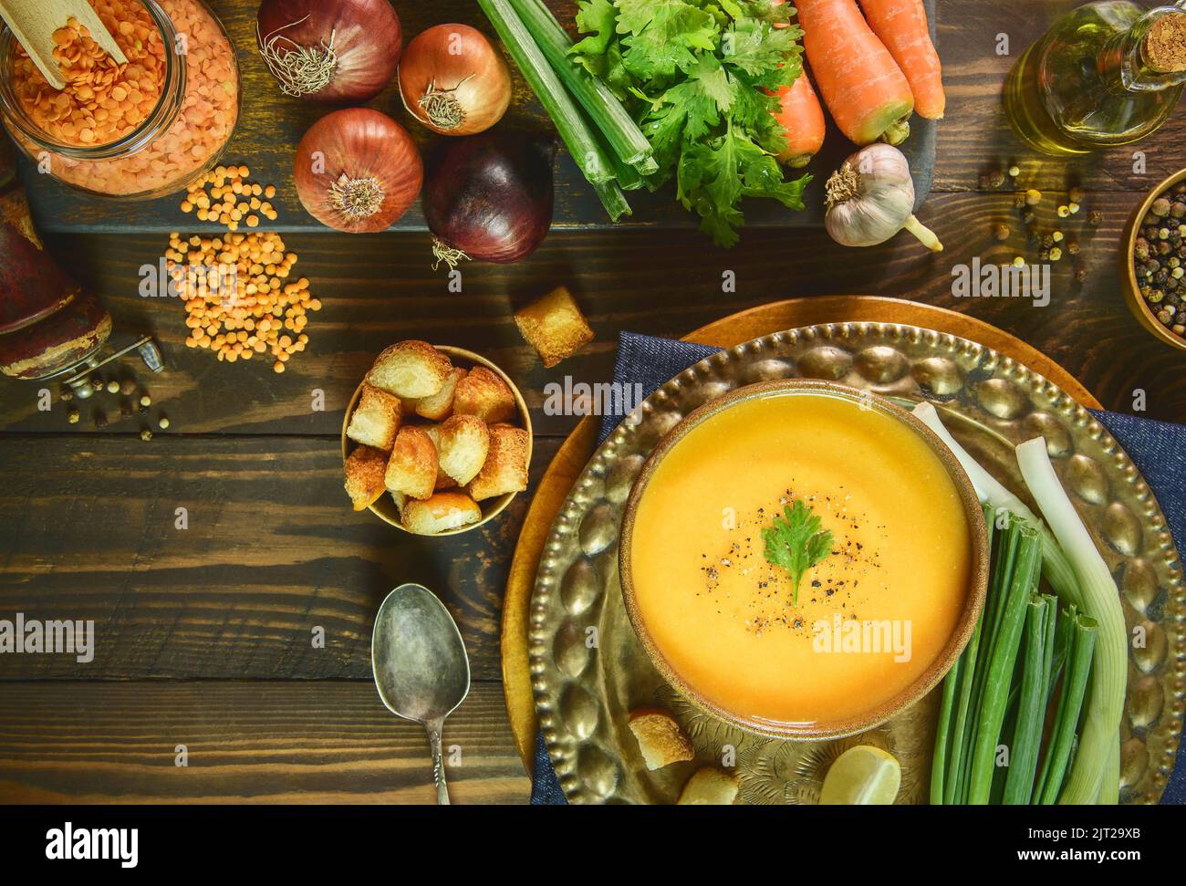 Arabic Cuisine; Middle Eastern traditional red lentil soup with fresh ...