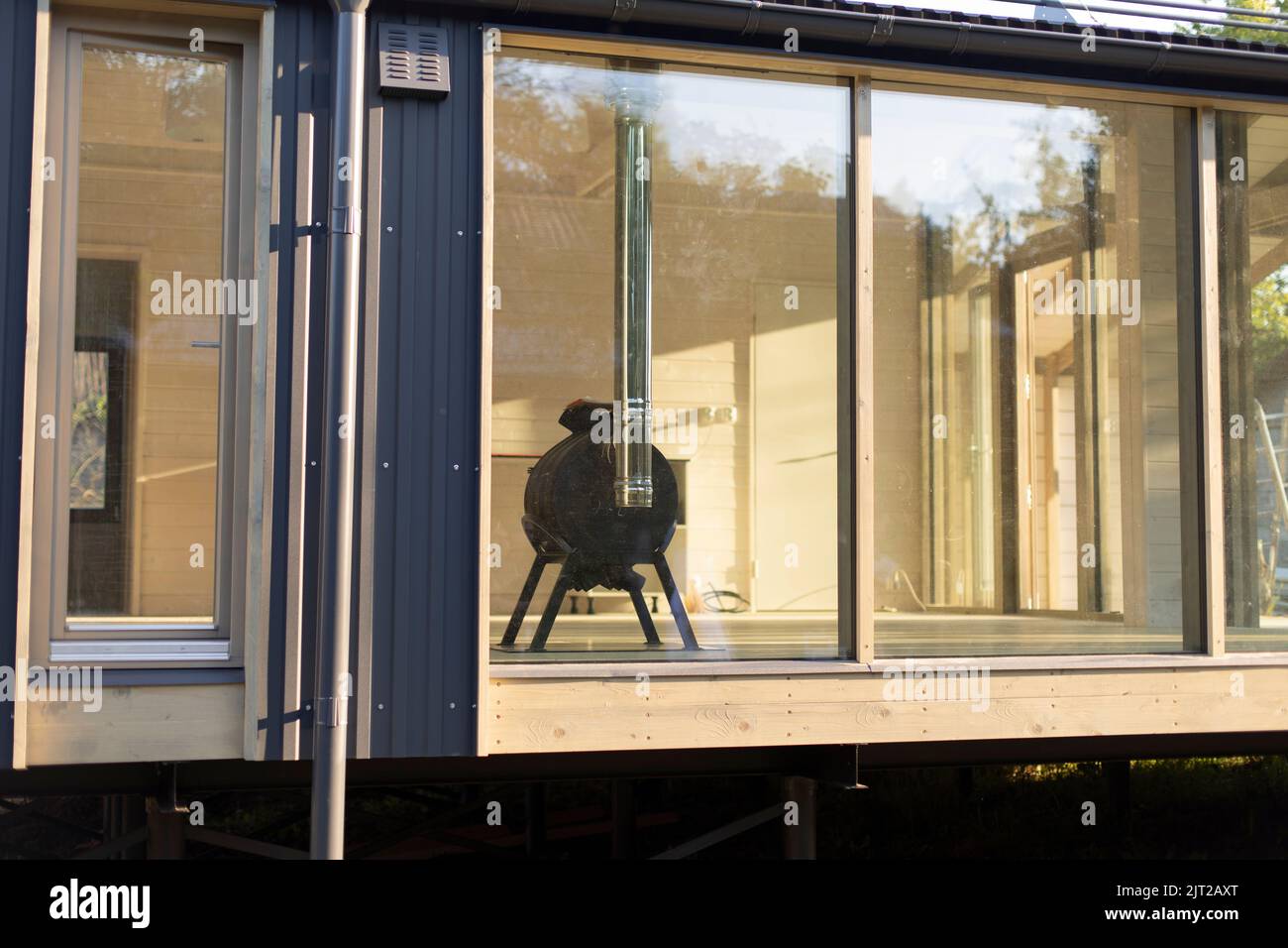 Fireplace inside house. Heating system in country house. Furnace pipe ...