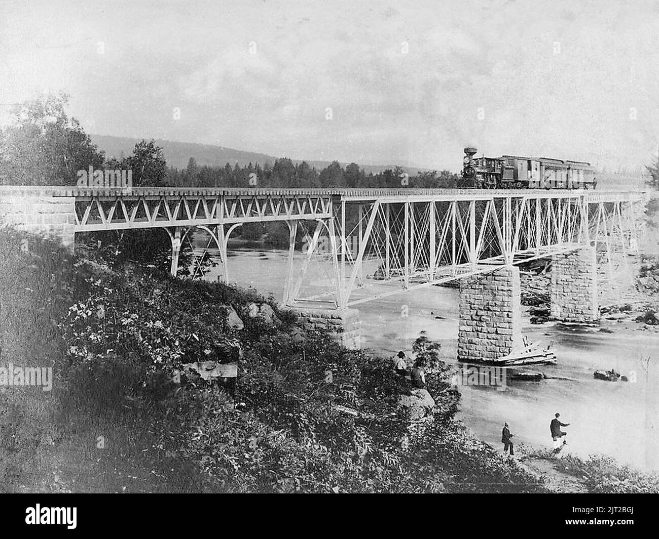 Train Crossing a Railroad Bridge Stock Photo - Alamy