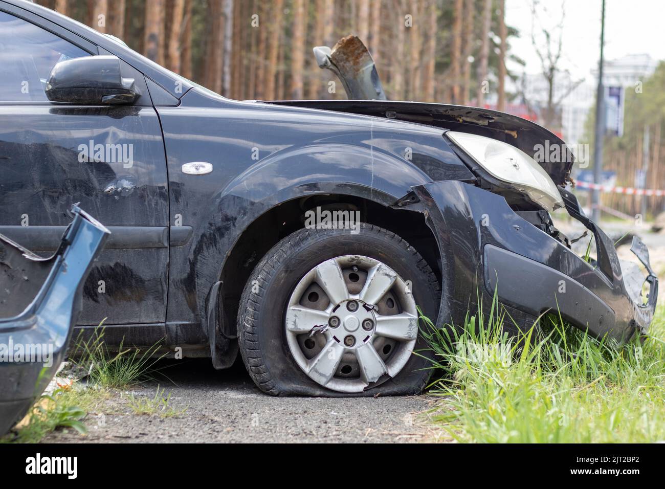Black car after a terrible accident on the side of the road. Frontal ...