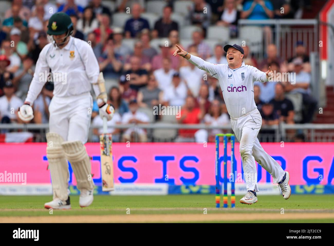 Ollie Pope of England celebrates the fall of the wicket of Anrich ...