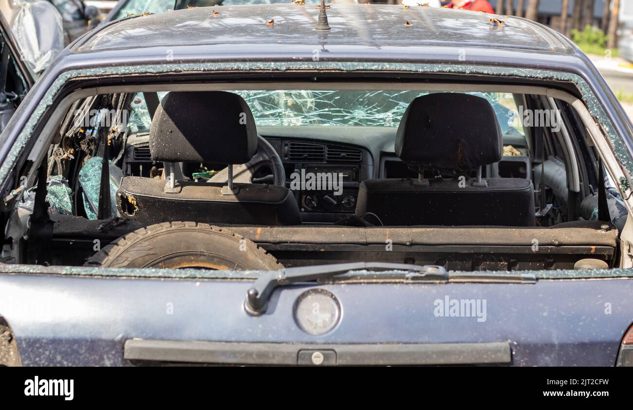 A car after an accident with a broken rear window. Broken window in a ...