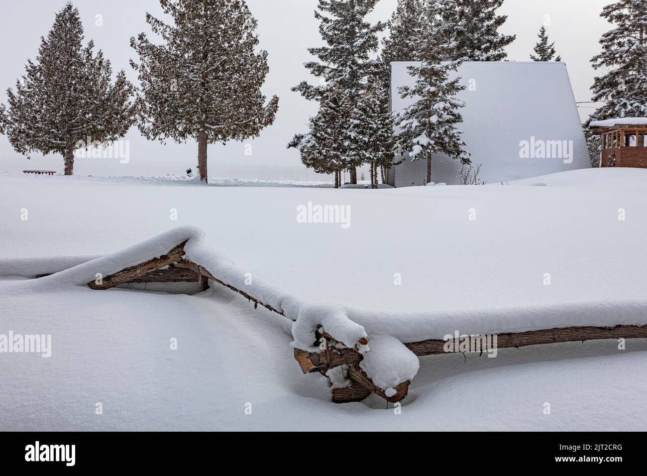 An A-Frame structure on Manitoulin Island with a foreground split-rail ...