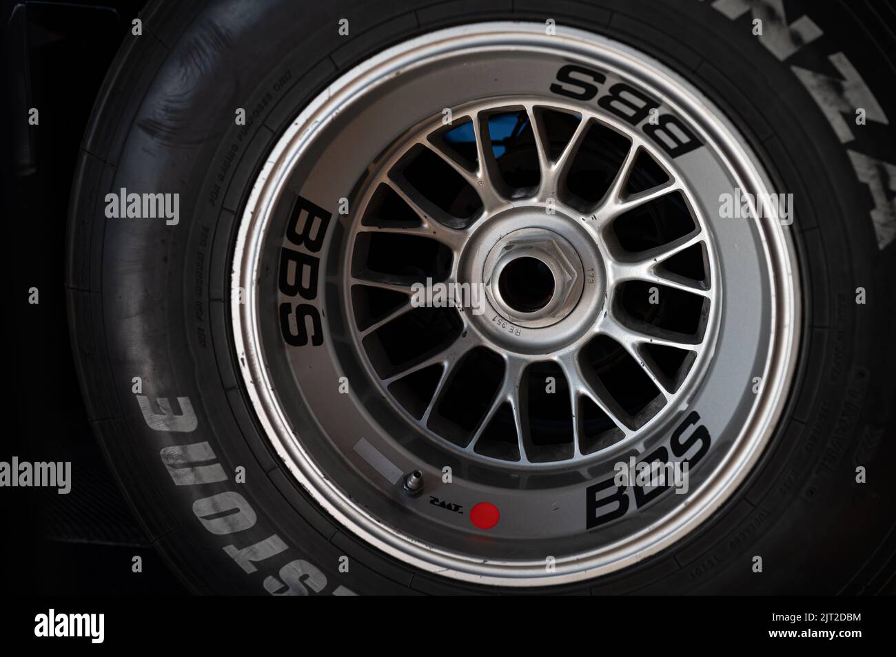 A closeup of a Formula 1 wheel with metallic BBs rim and a Bridgestone ...