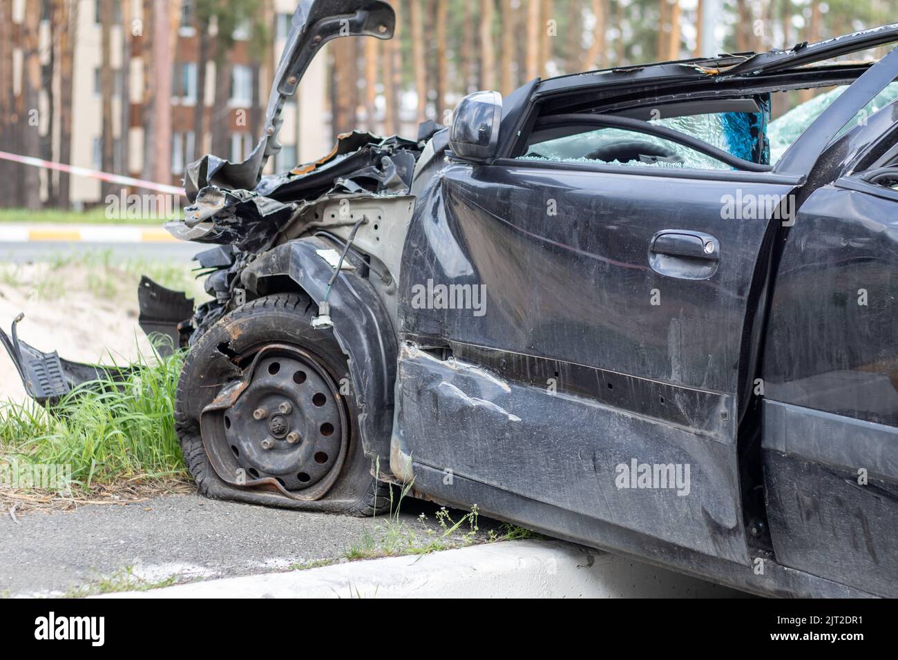 Black car after a terrible accident on the side of the road. Frontal ...