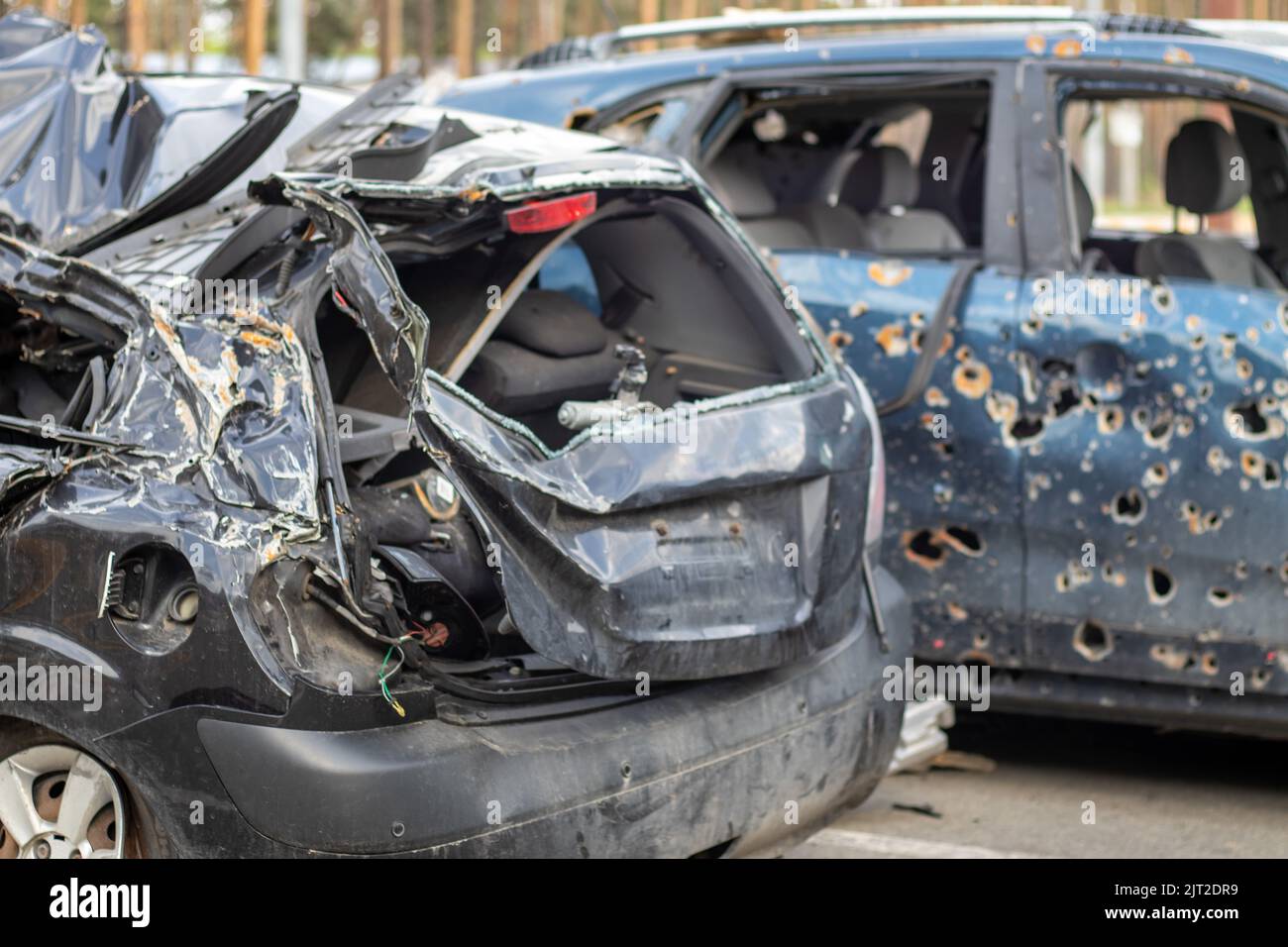 Car riddled with bullets. War of Russia against Ukraine. A car of ...