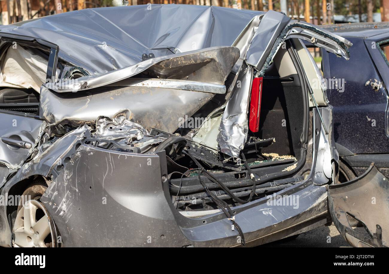 Shot car during the war in Ukraine. A car after an accident with a ...