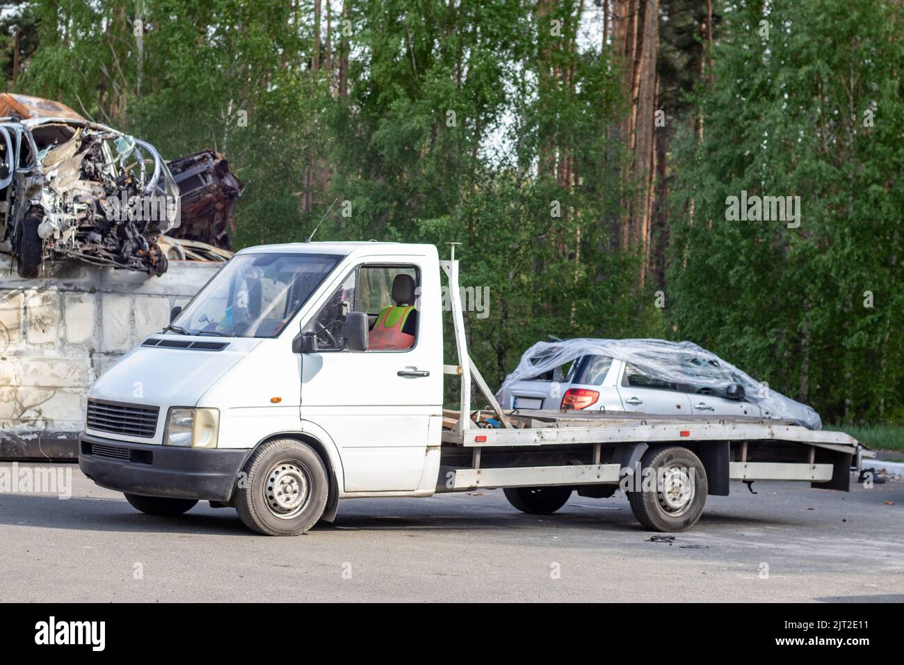 Lots of old cars ready for recycling. Car removal by tow truck. The car ...