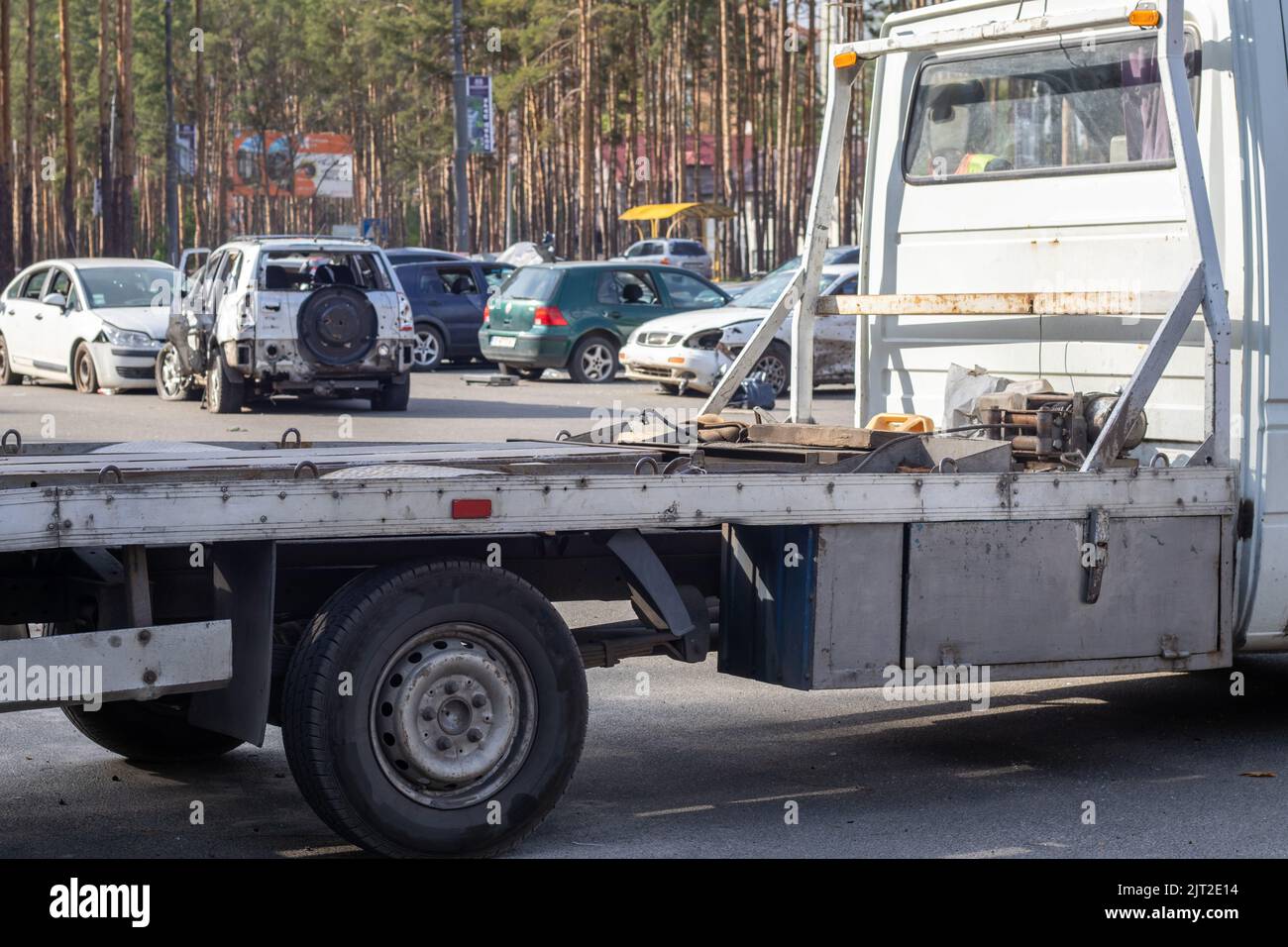 Lots of old cars ready for recycling. Car removal by tow truck. The car ...