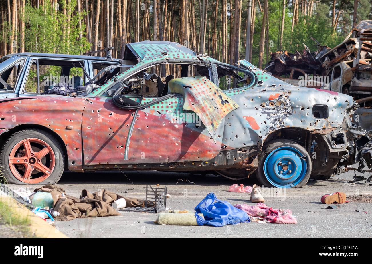 Car riddled with bullets. War of Russia against Ukraine. A car of ...