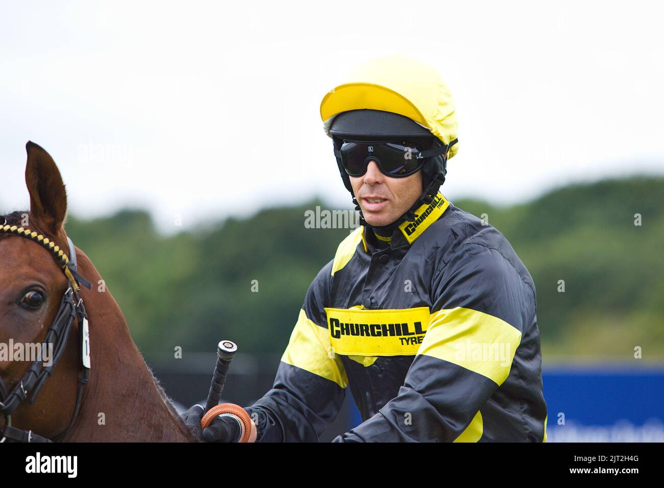 Jockey Graham Lee on Reginald Charles before the start of a race at ...