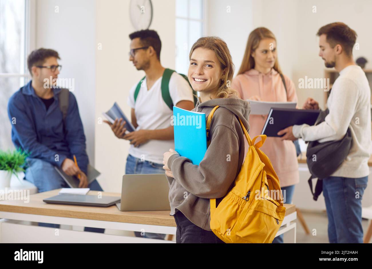 Portrait of smiling girl student with backpack Stock Photo - Alamy